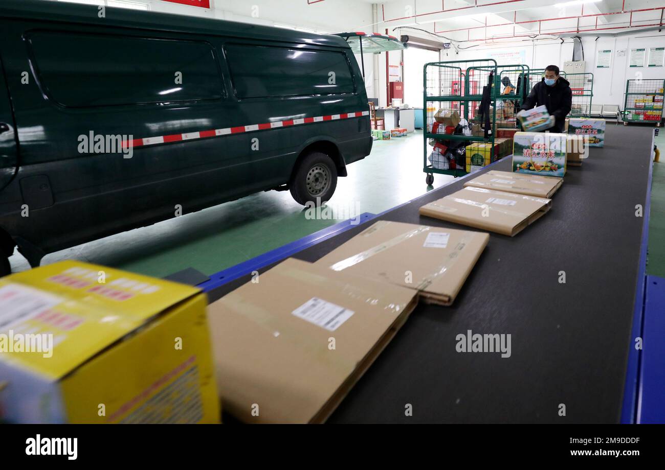 ZIXING, CHINA - JANUARY 17, 2023 - Staff members sort express parcels ...