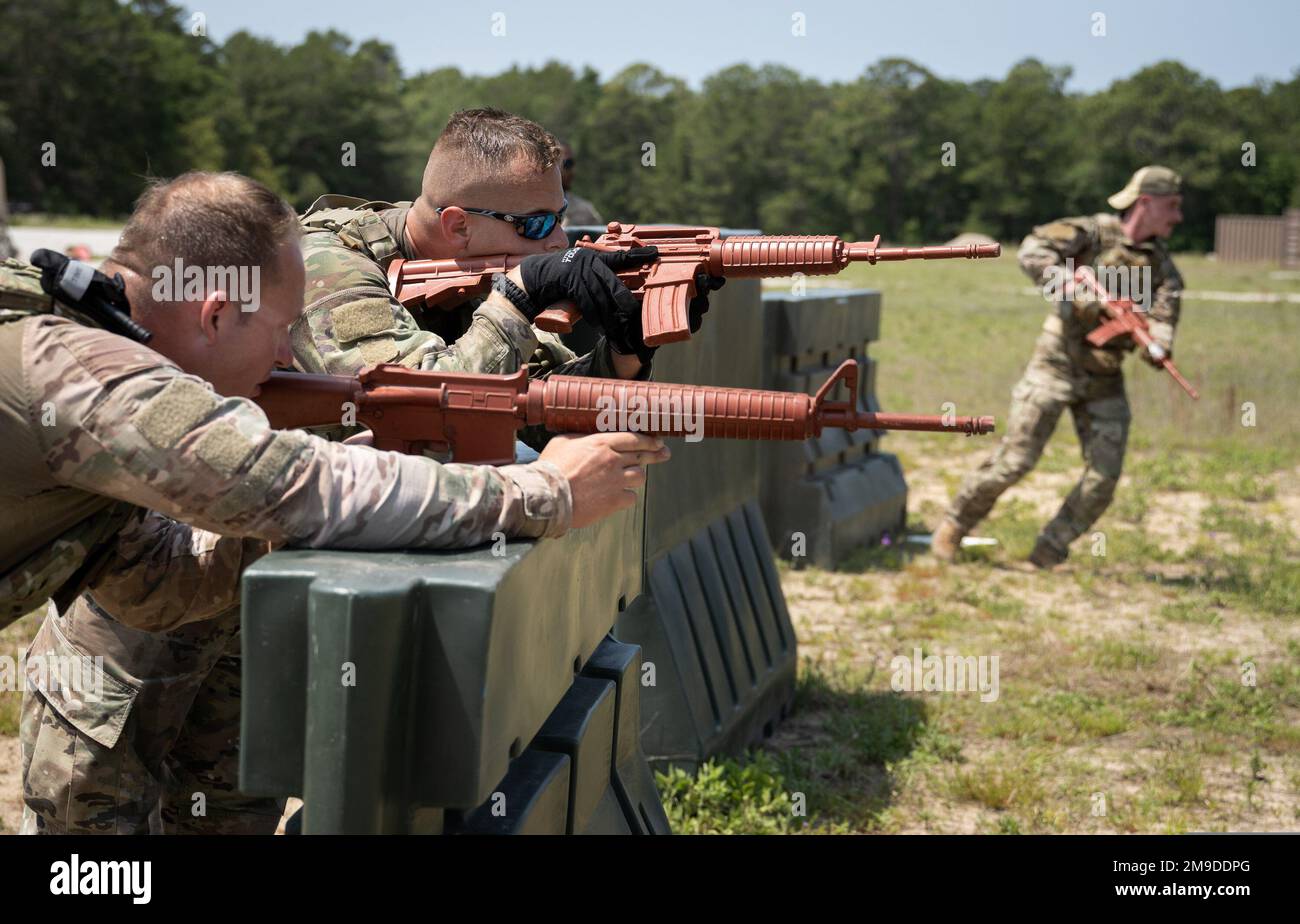 Airmen provide covering fire as their teammate advances during part of ...