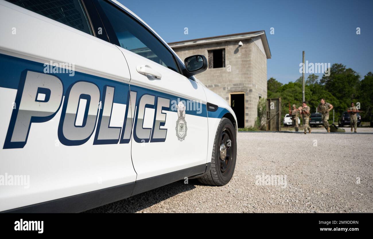 A four-person team runs with a 70-pound sled during part of the ...