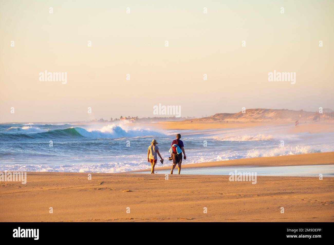 Todos Santos, Baja California, Mexico, a couple walking on the beach ...