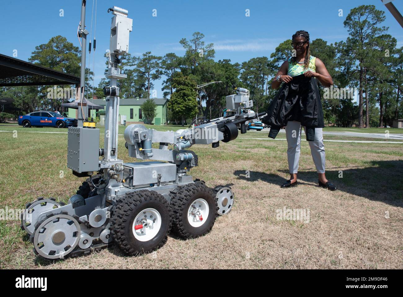 A Remotec Andros F-6B tactical robot hands a jacket to an observer ...