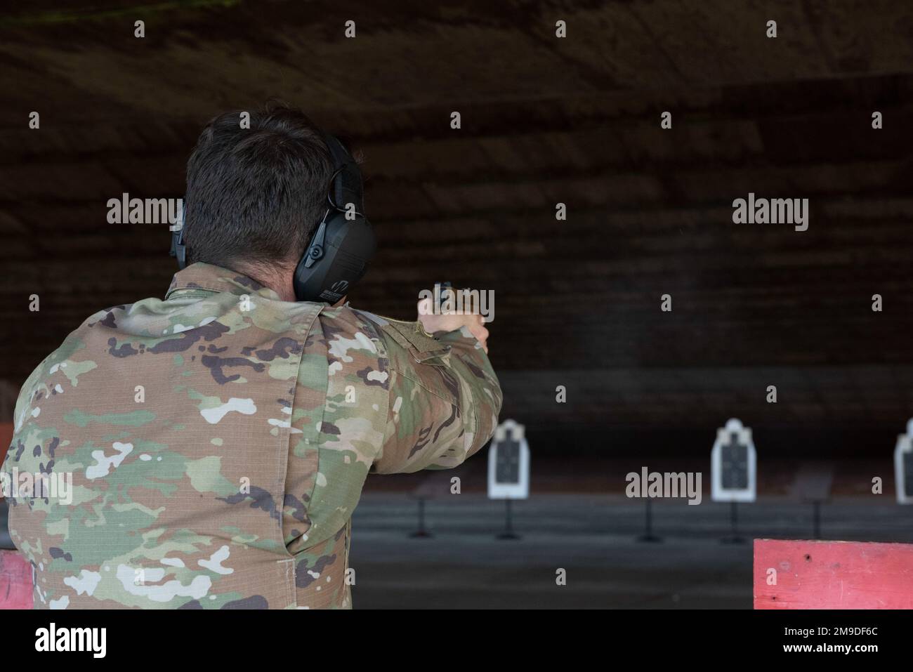 A U.S. Air Force Airman fires at targets during an Excellence-In ...