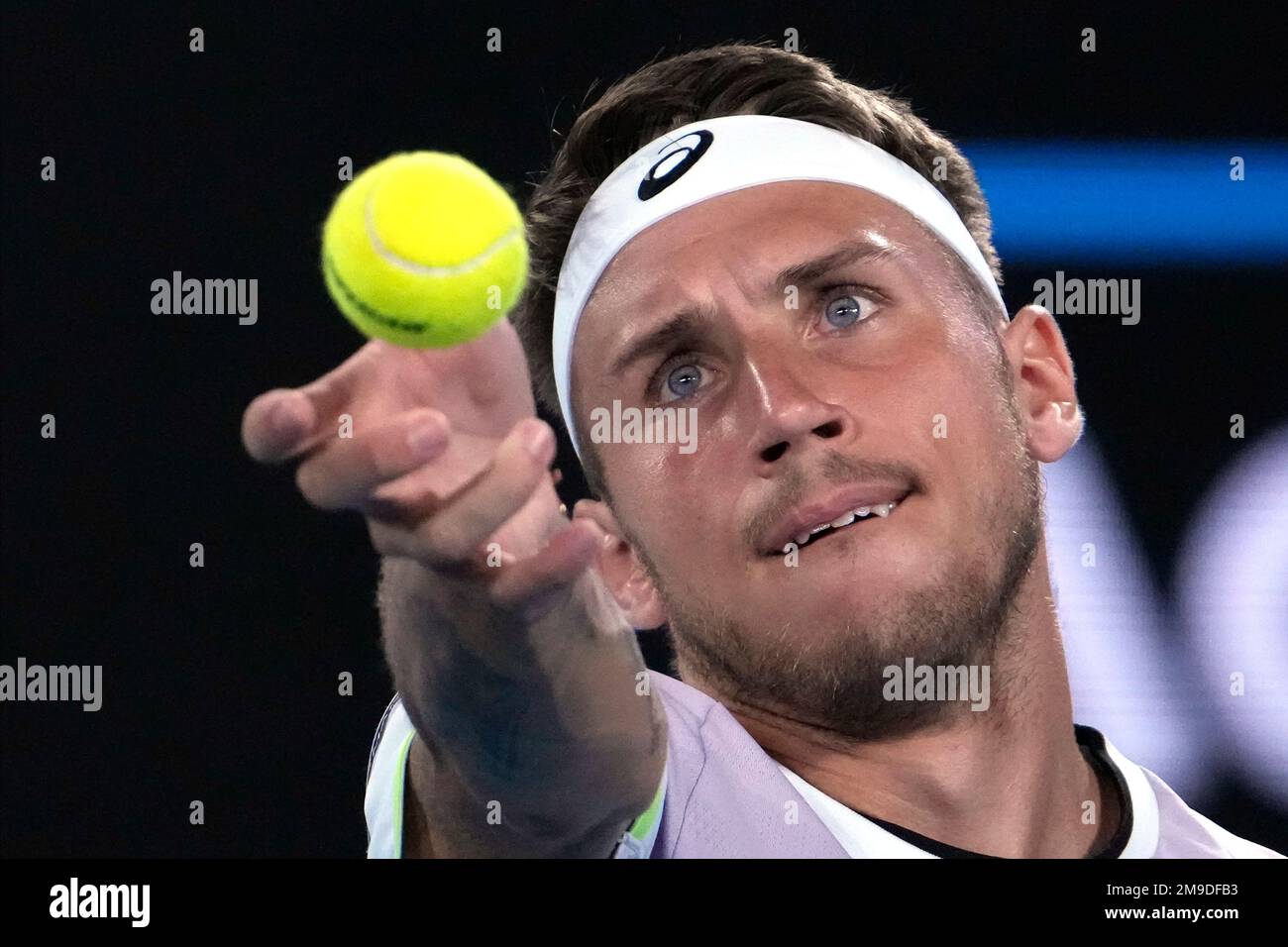 Alex Molcan of Slovakia serves to Felix Auger-Aliassime of Canada ...