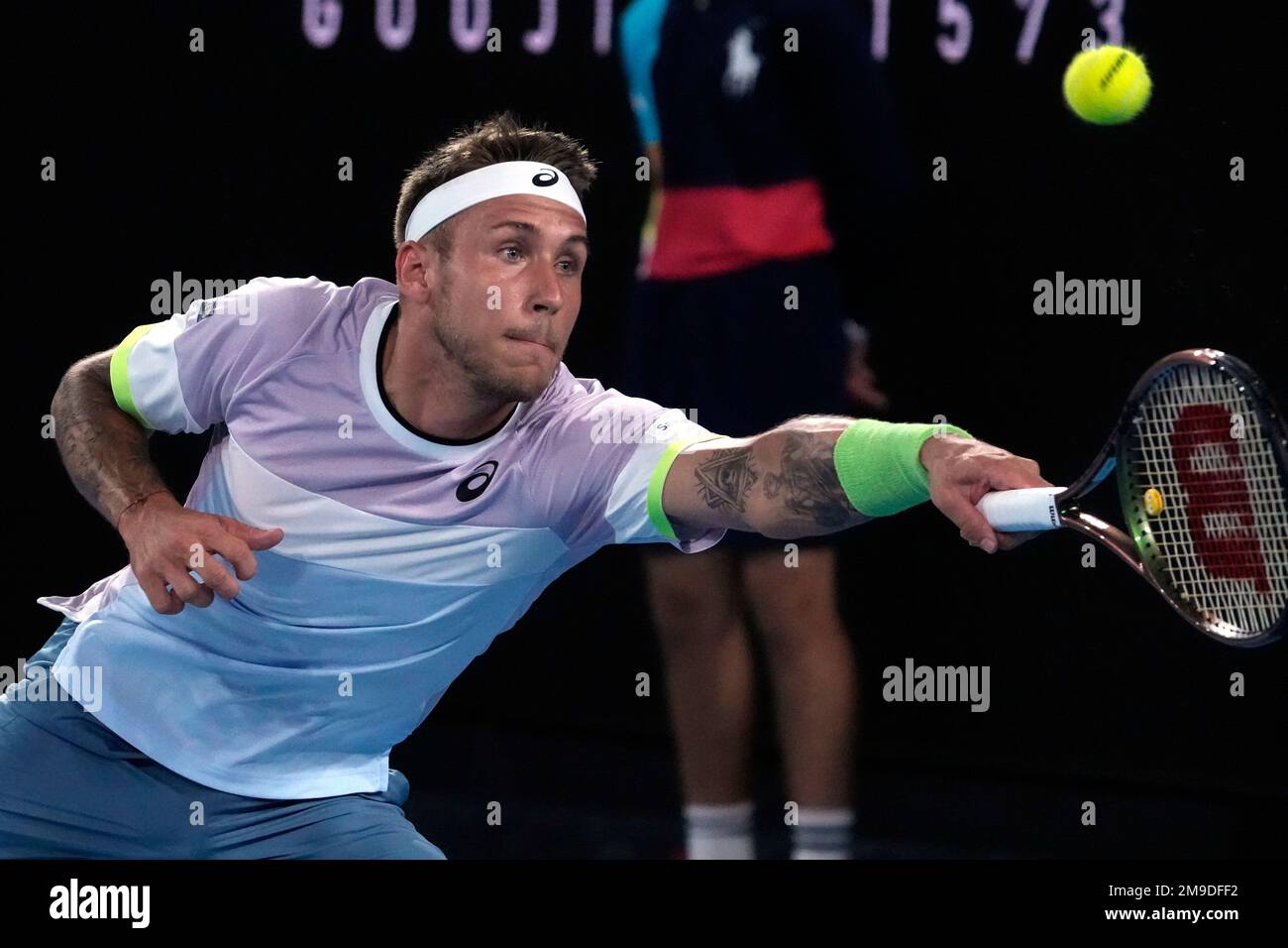 Alex Molcan of Slovakia plays a forehand return to Felix Auger-Aliassime of Canada during their ...
