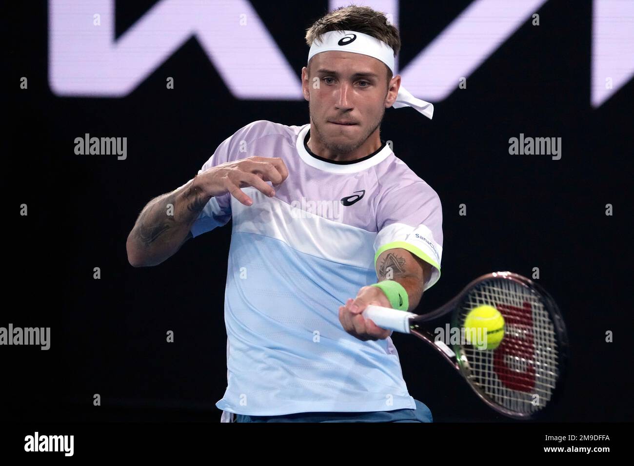 Alex Molcan of Slovakia plays a forehand return to Felix Auger-Aliassime of Canada during their ...