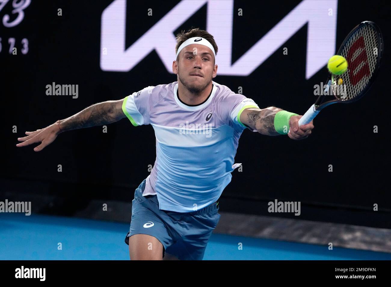 Alex Molcan of Slovakia plays a forehand return to Felix Auger-Aliassime of Canada during their ...