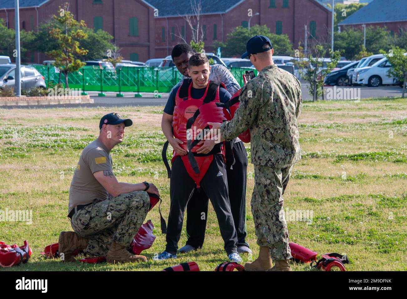 SASEBO, Japan (May 17, 2022) Yeoman 2nd Class Lane McAdams, center ...