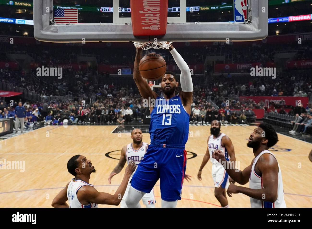 Los Angeles Clippers guard Paul George (13) dunks during the first half of an NBA basketball ...