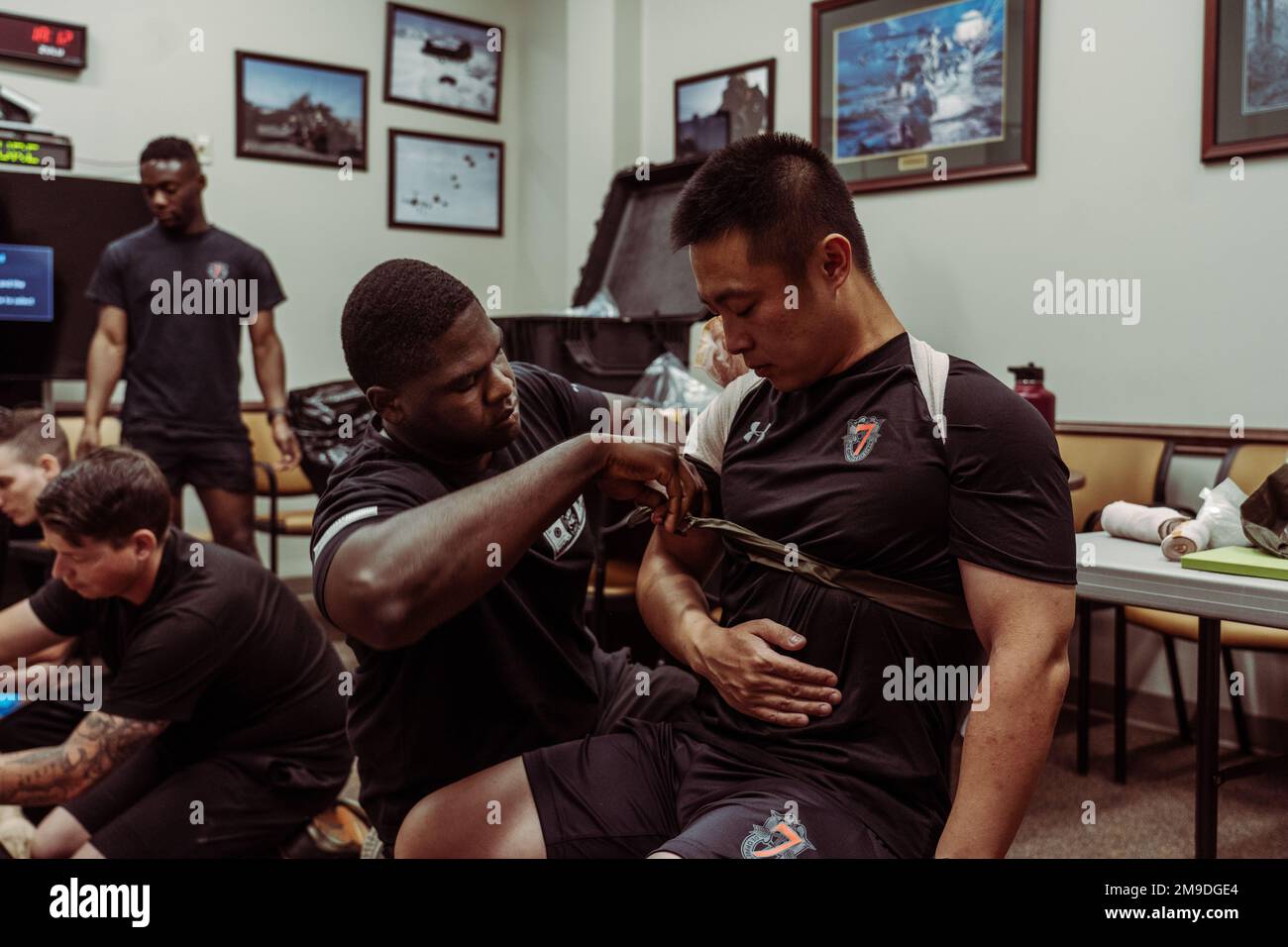 Soldier of 7th Special Forces Group (Airborne) applies axillary ...