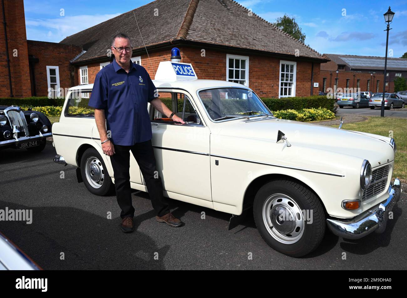 Steve Woodman, a police car United Kingdom member, presents a retired ...