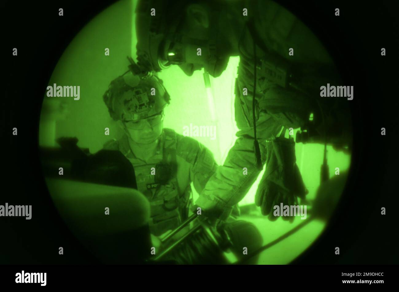 EOD technicians plan and prepare equipment to diffuse explosives in a ...