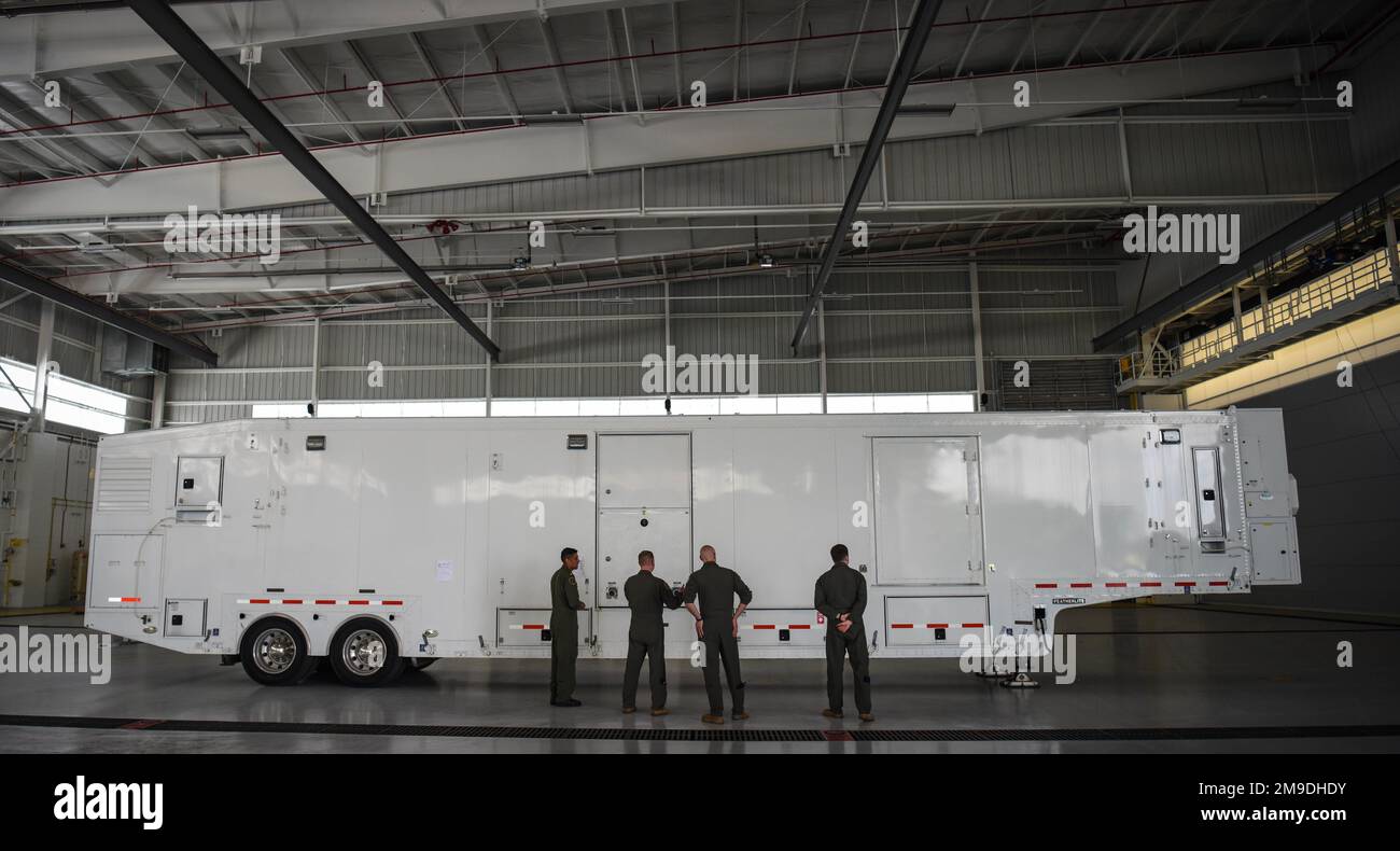 U.S. Navy Lt. Cmdr. Joel Pena, left, Unmanned Patrol Squadron 19 (VUP ...