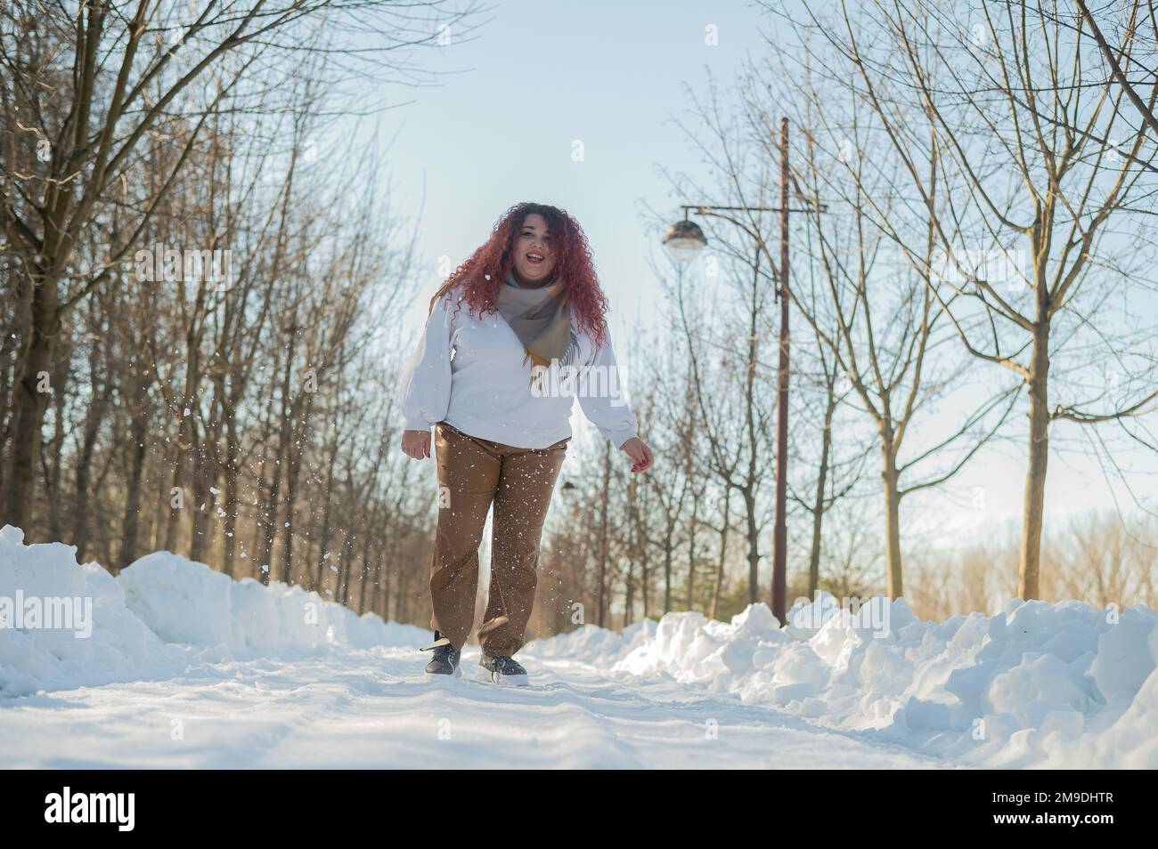 Red haired woman running hi-res stock photography and images - Alamy