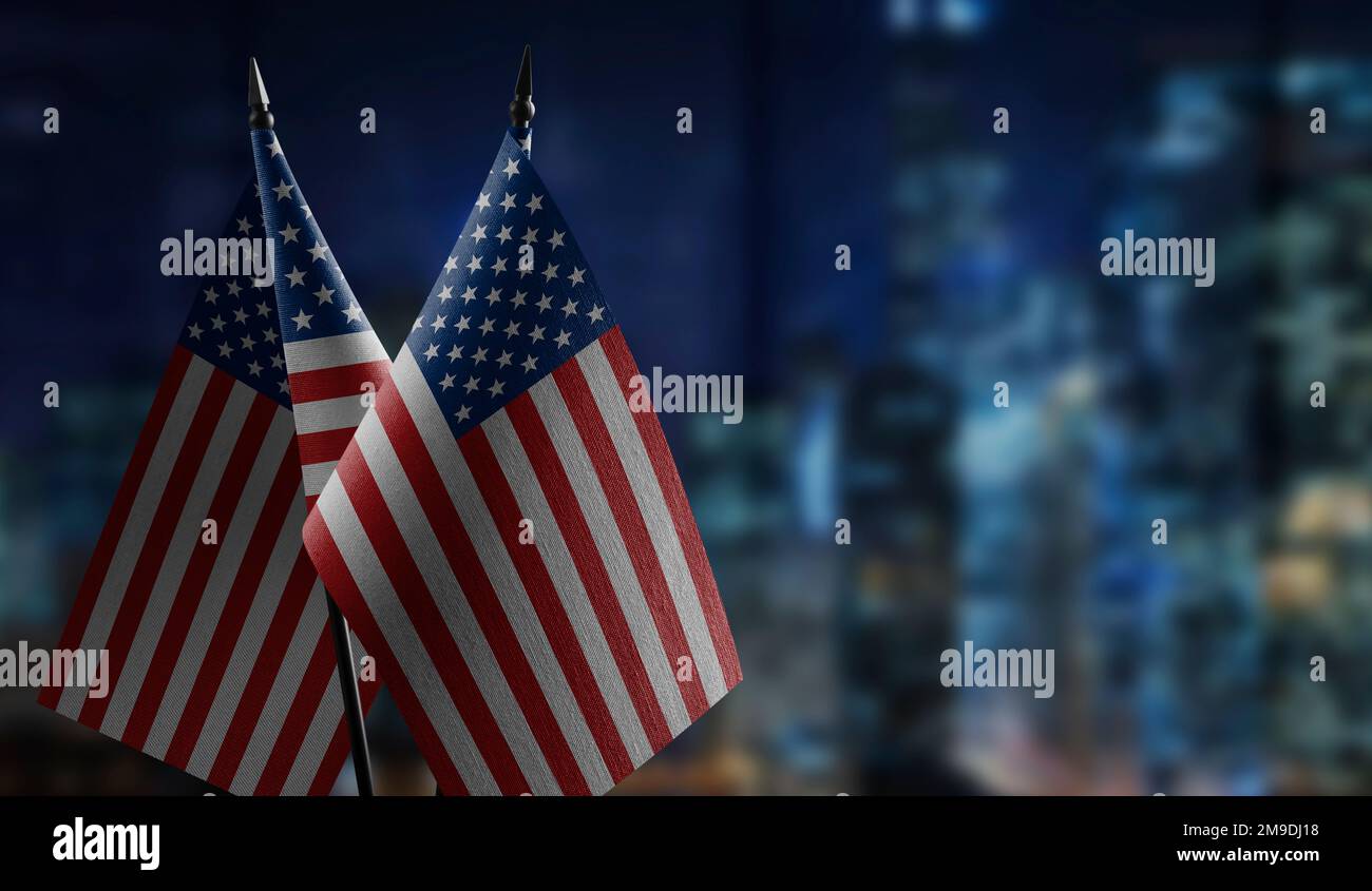 Small flags of the USA on an abstract blurry background Stock Photo - Alamy