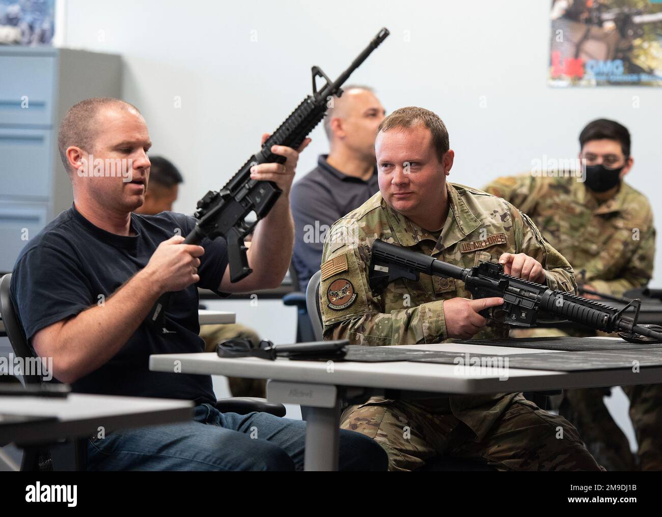 Competitors check out the M4 rifles issued to them May 17, 2022, for ...
