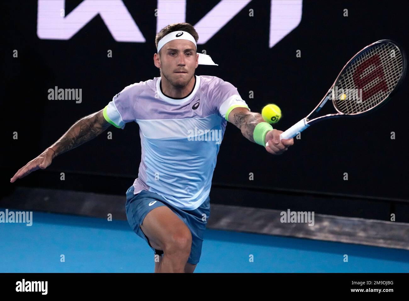 Alex Molcan of Slovakia plays a forehand return to Felix Auger-Aliassime of Canada during their ...