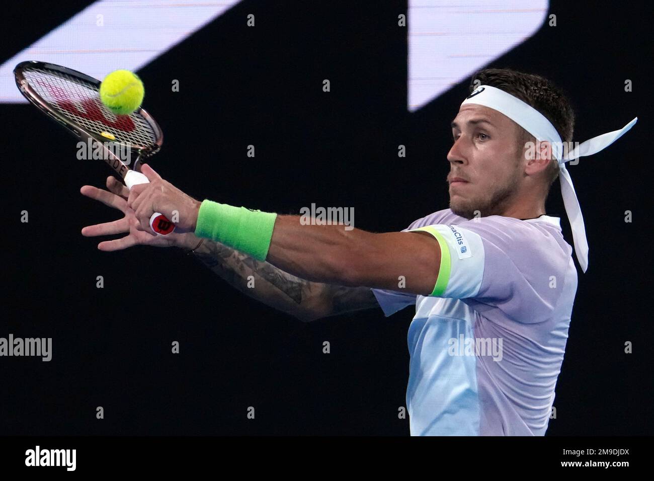 Alex Molcan of Slovakia plays a backhand return to Felix Auger-Aliassime of Canada during their ...