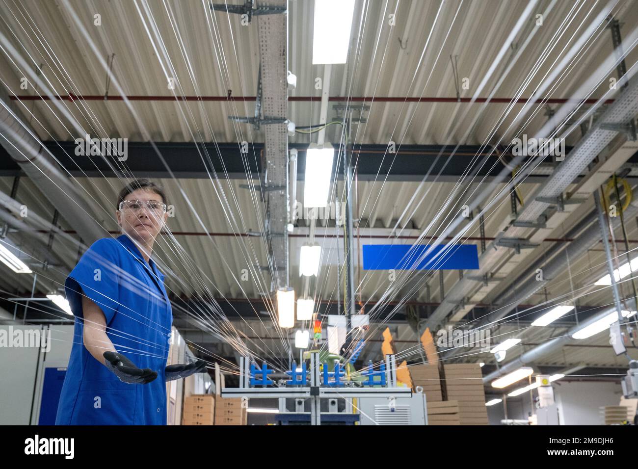 Mainz, Germany. 12th Jan, 2023. A Schott AG employee works in the ...