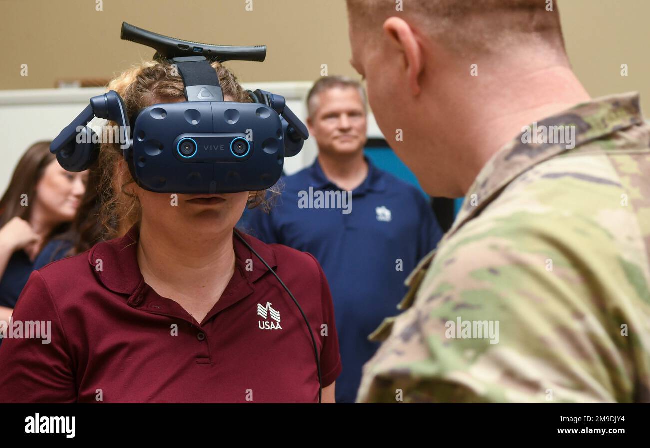 A USAA employee wears a virtual reality headset while Maj. Paul Lentz ...
