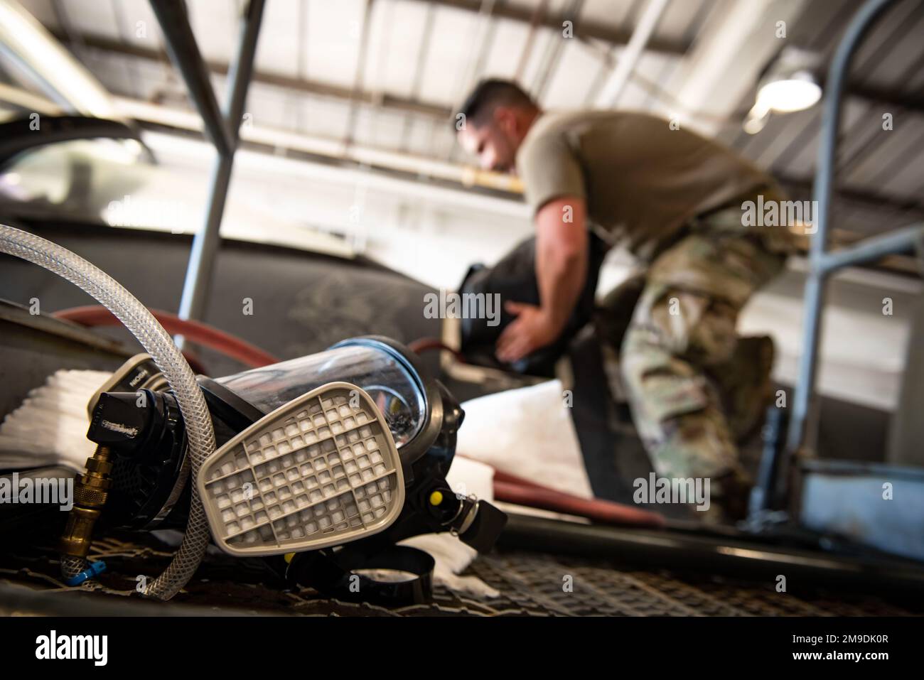 A U.S. Air Force Airman places a new F1 fuel cell into an F-16 fuel ...