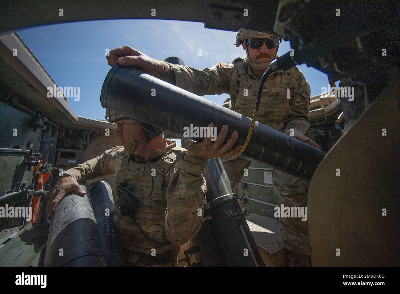 Idaho Army National Guard Sgt. Tristan Gillaspy passes mortar rounds to ...