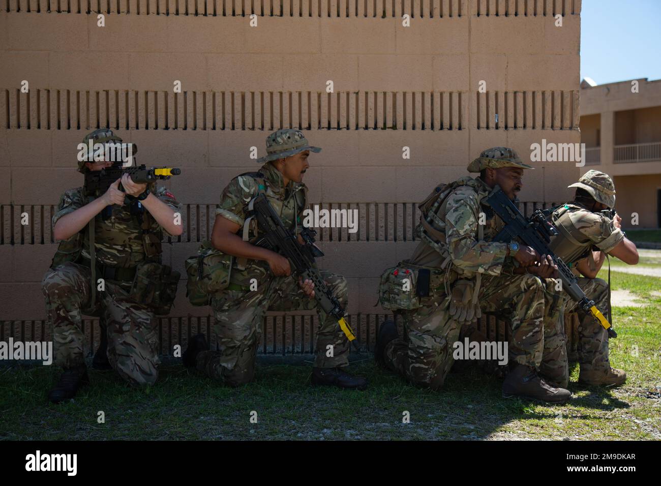 A service member of the Royal Bermuda Regiment provides security while ...