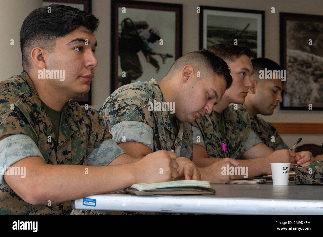 U.S. Marines with the 31st Marine Expeditionary Unit (MEU) listen and ...