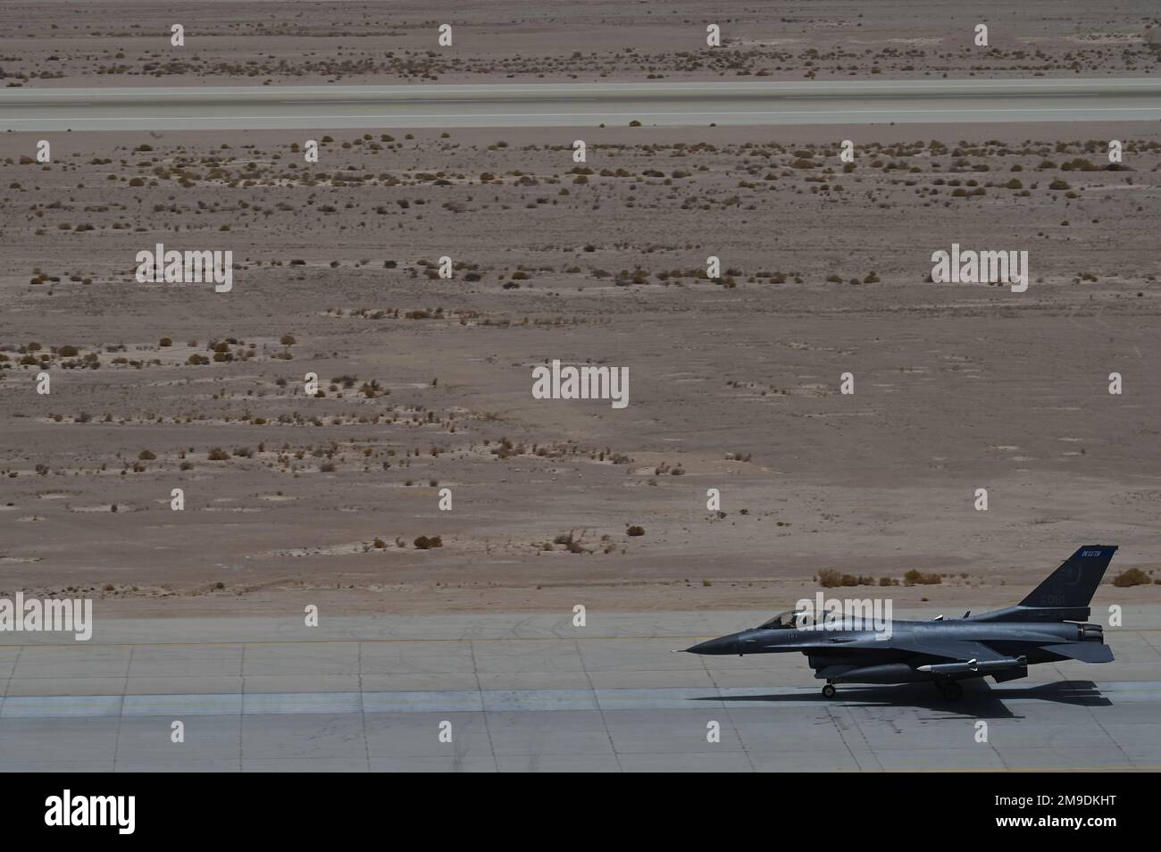 A U.S. Air Force F-16 Fighting Falcon taxis down the runway at Thumrait ...
