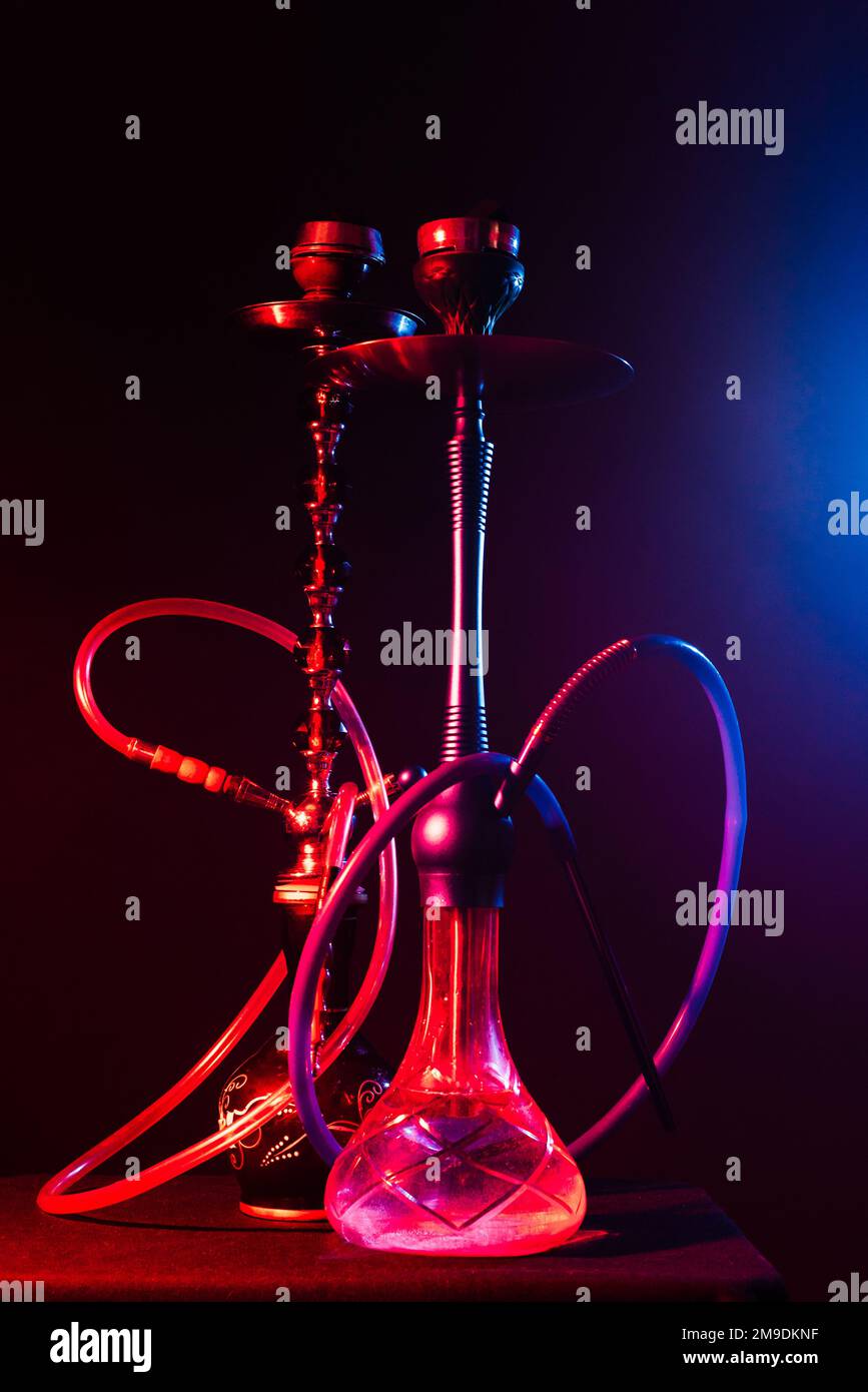 modern hookah, shisha on black background with neon lighting Stock ...