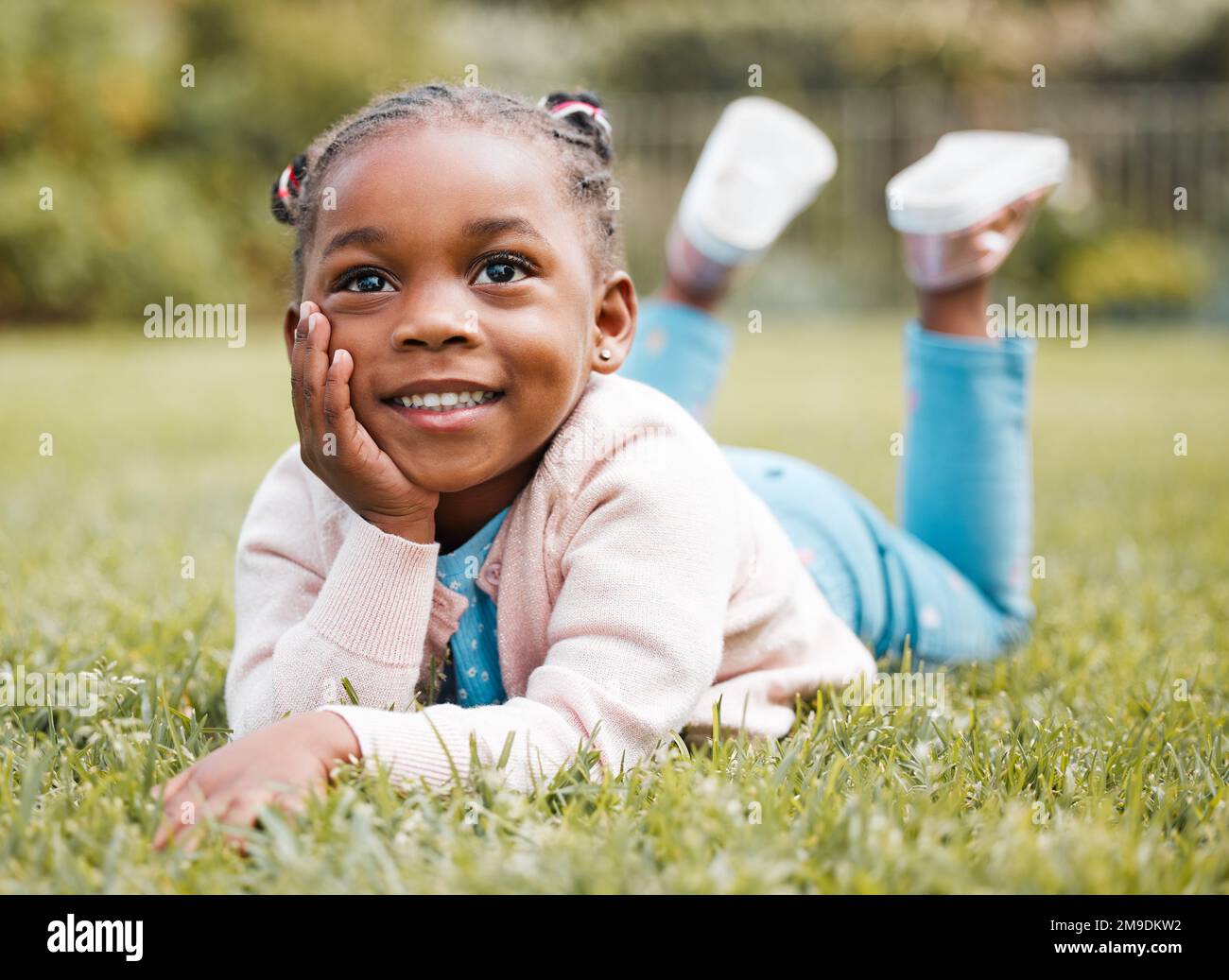 Never going back inside. a little girl happily spending time alone in ...