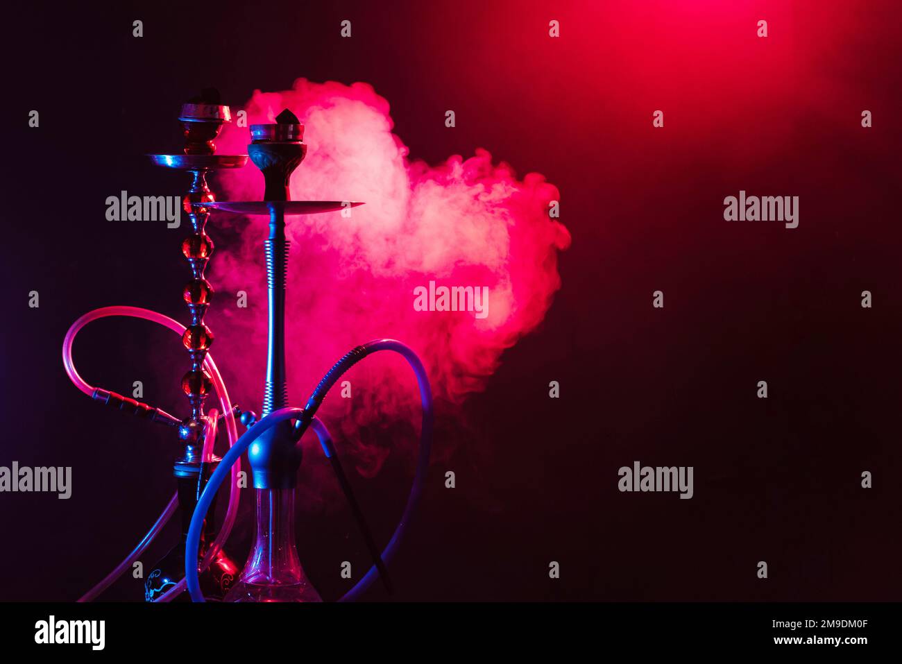 Hookah, shisha on smoky black background with neon lighting and smoke ...