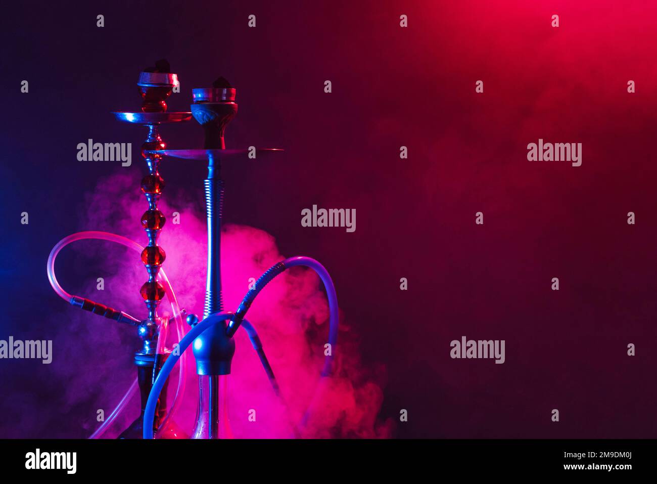 Modern hookah, shisha on smoky black background with neon lighting and ...