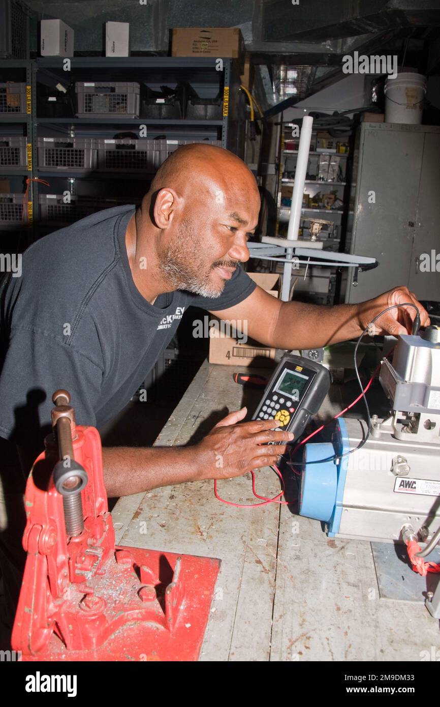 McKinley Climatic Laboratory team member Chatree Jones checks for valve ...