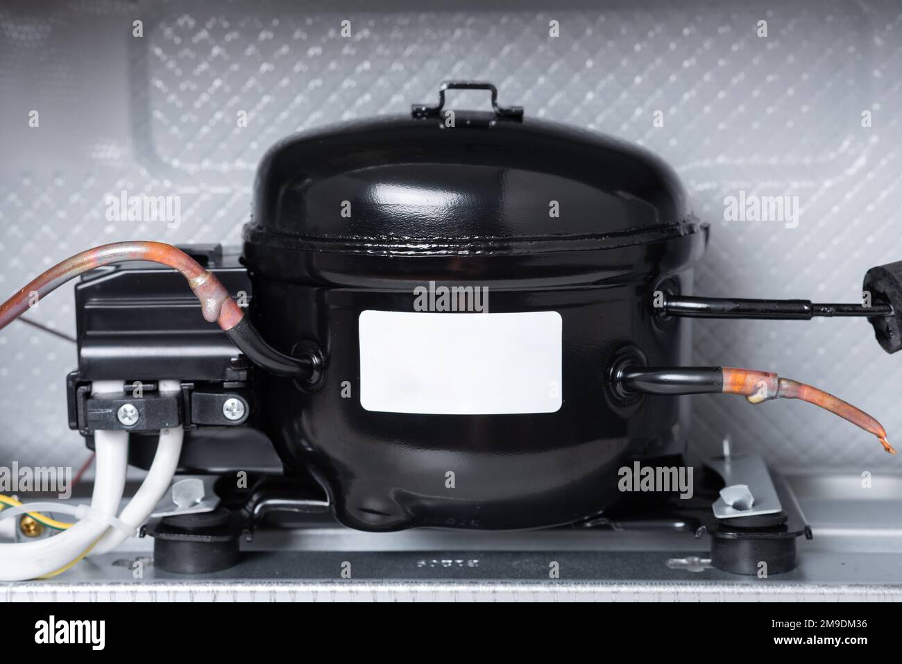 Close up refrigerator compressor mounted on the minibar Stock Photo - Alamy