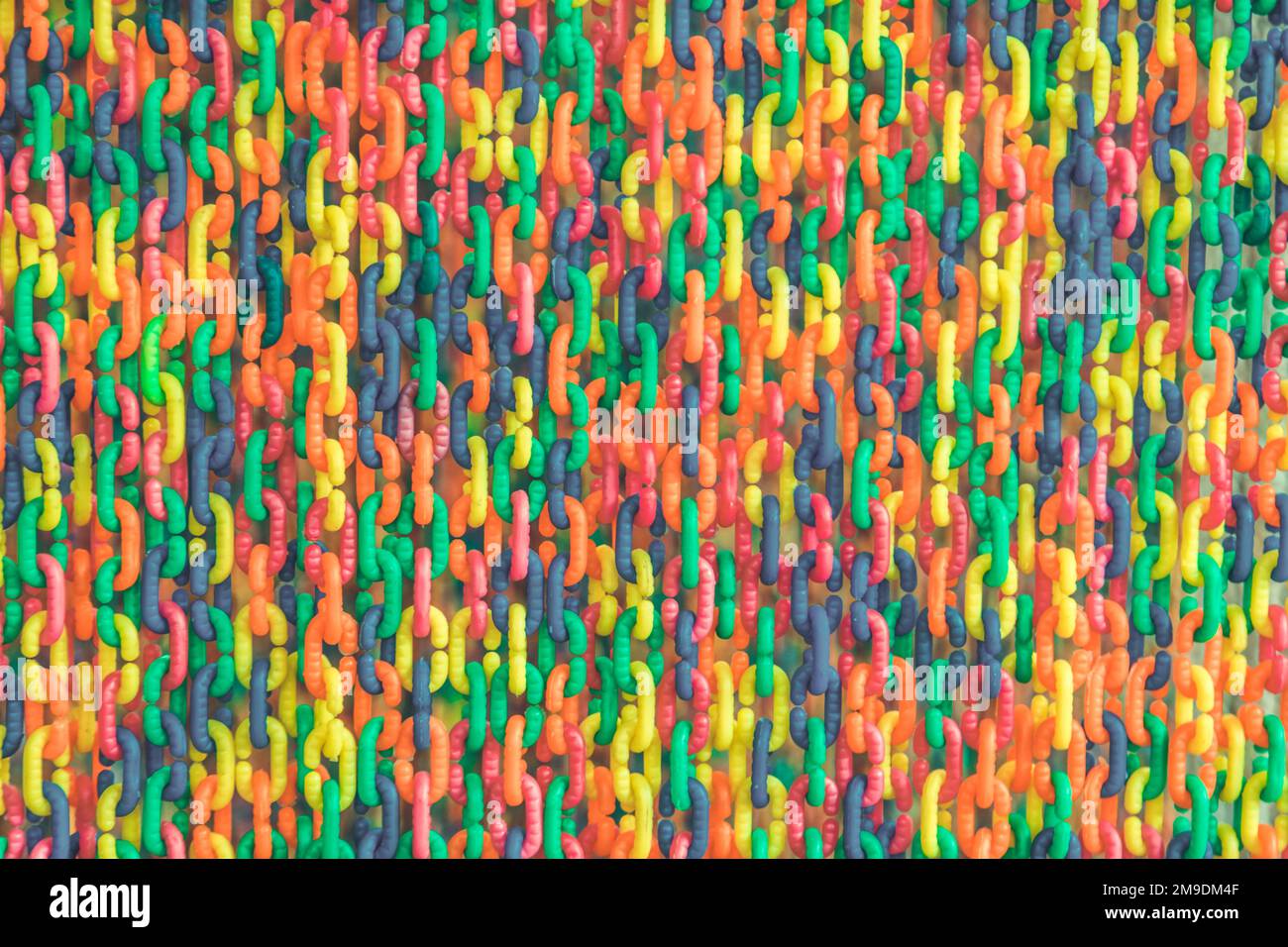 Colorful plastic chain background Stock Photo - Alamy