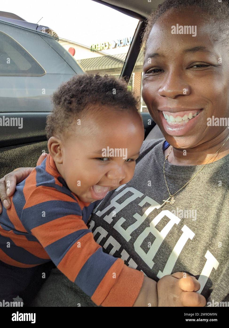Staff Sgt. Kimberly Gary takes a selfie with the baby she agreed to ...