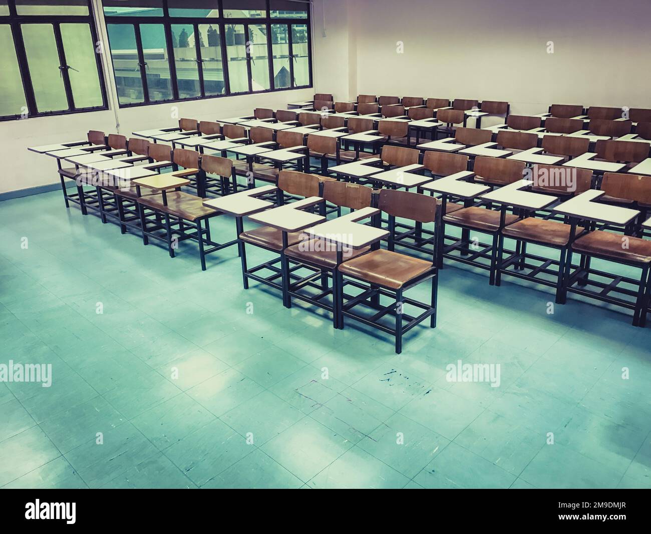 Wooden chairs in the classroom background Stock Photo - Alamy
