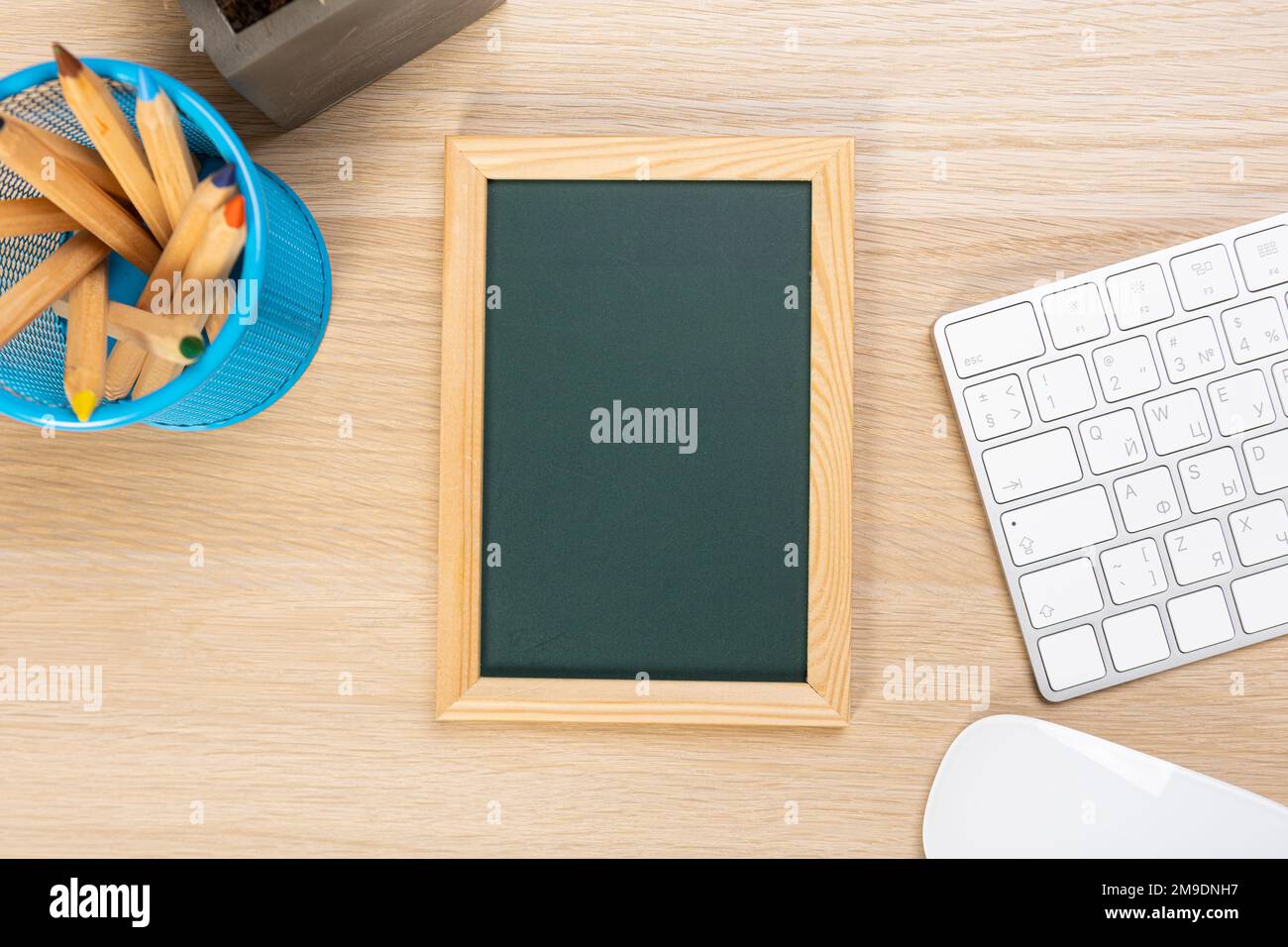 School chalkboard mockup on work desk. Composition of a student's desk ...