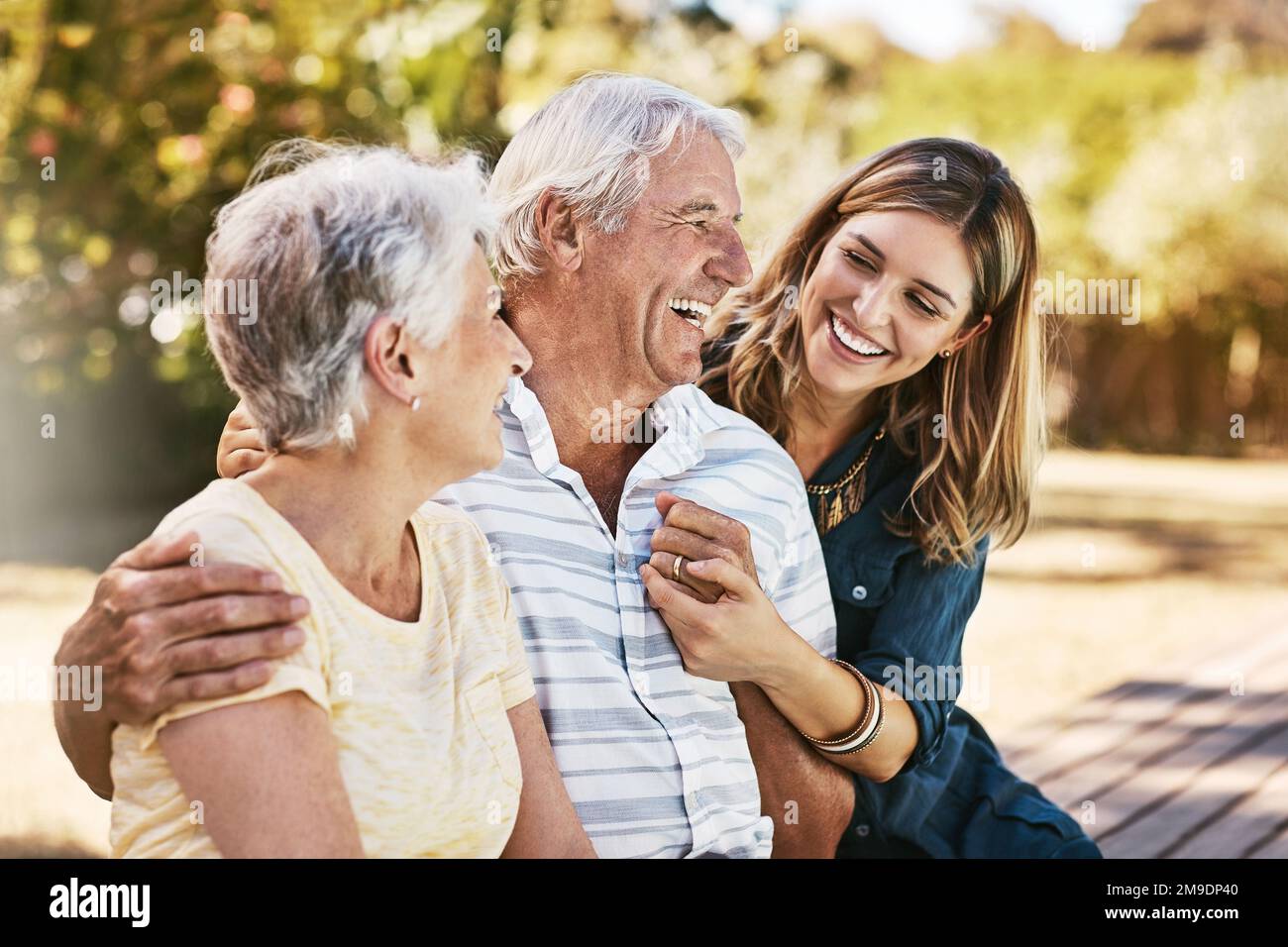 Family, senior parents and woman holding with care, love and hug ...