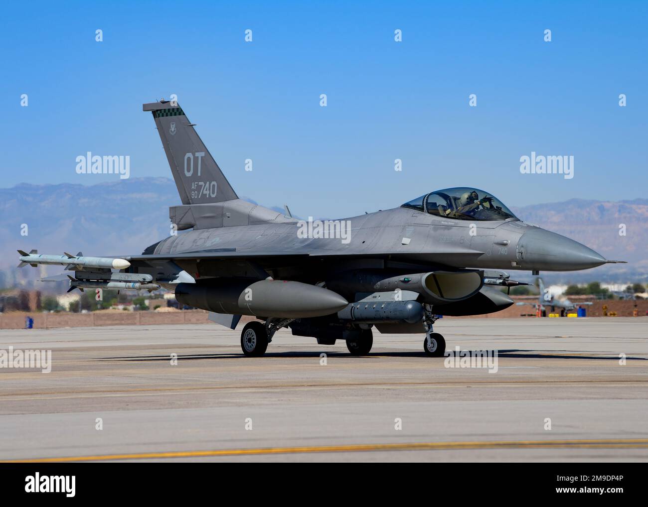 An F-16 assigned to the 422nd Test and Evaluation Squadron taxis out ...