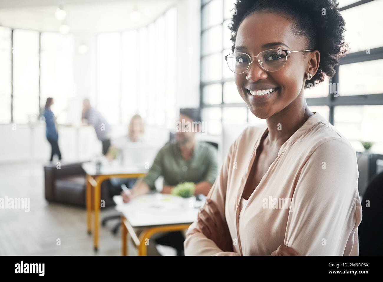 Portrait, business and black woman arms crossed in office, smile and confident entrepreneur ...