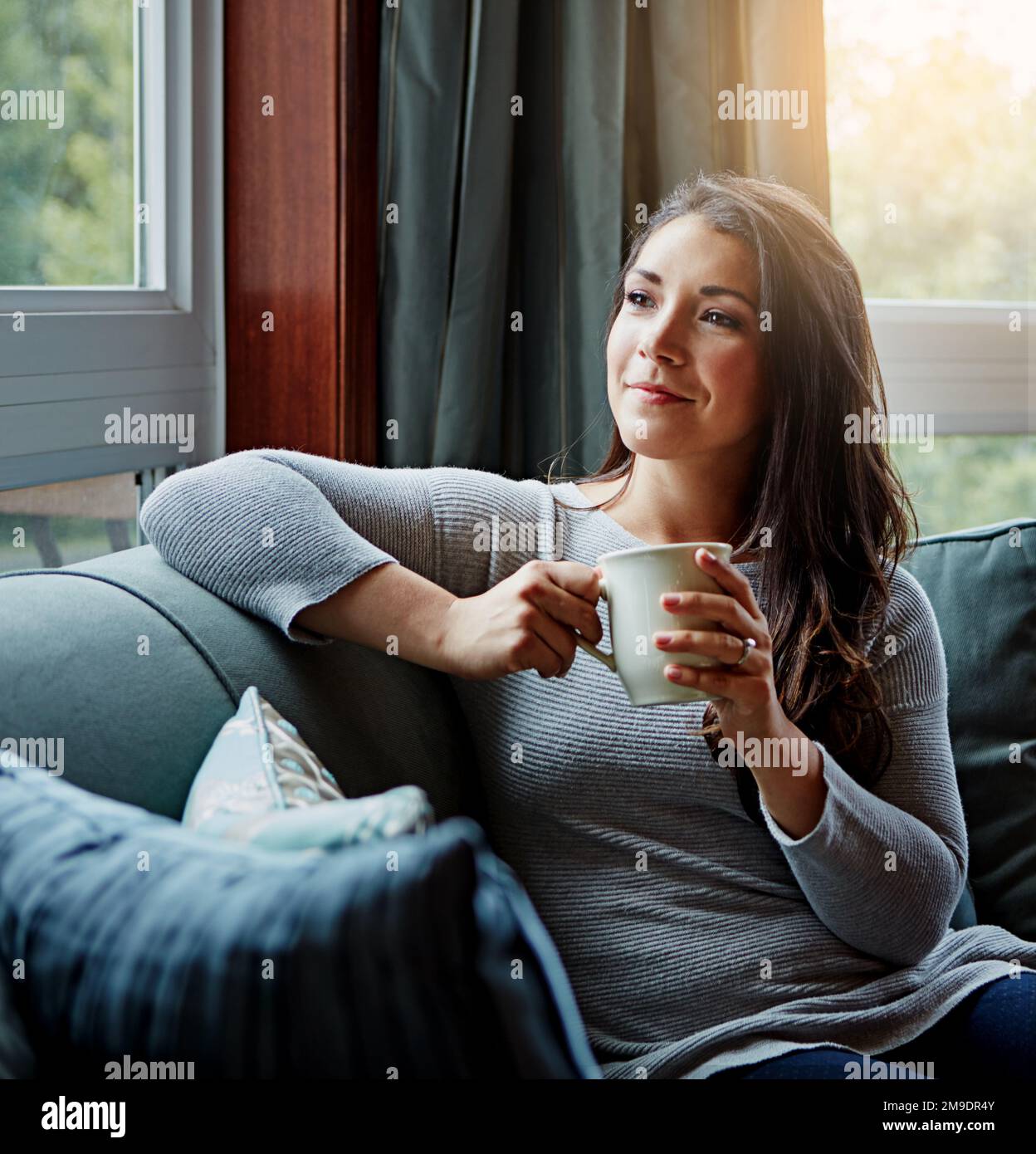 Happiness, coffee and woman thinking, sofa and relax on weekend, break ...