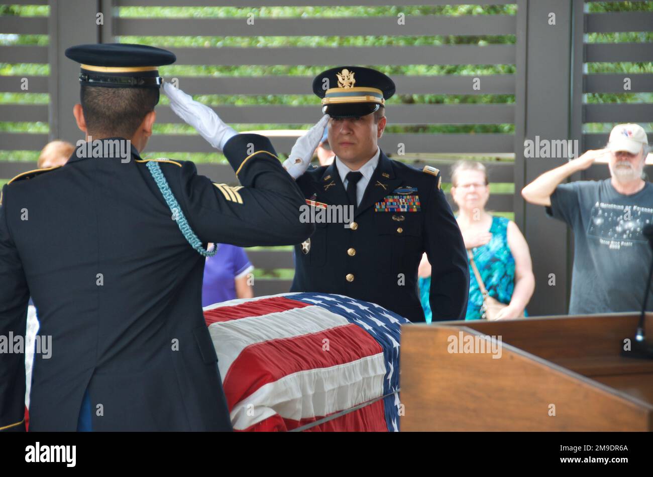 Soldiers from the 36th Infantry Division salute the casket of Spc. Daniel George Hegarty as he ...