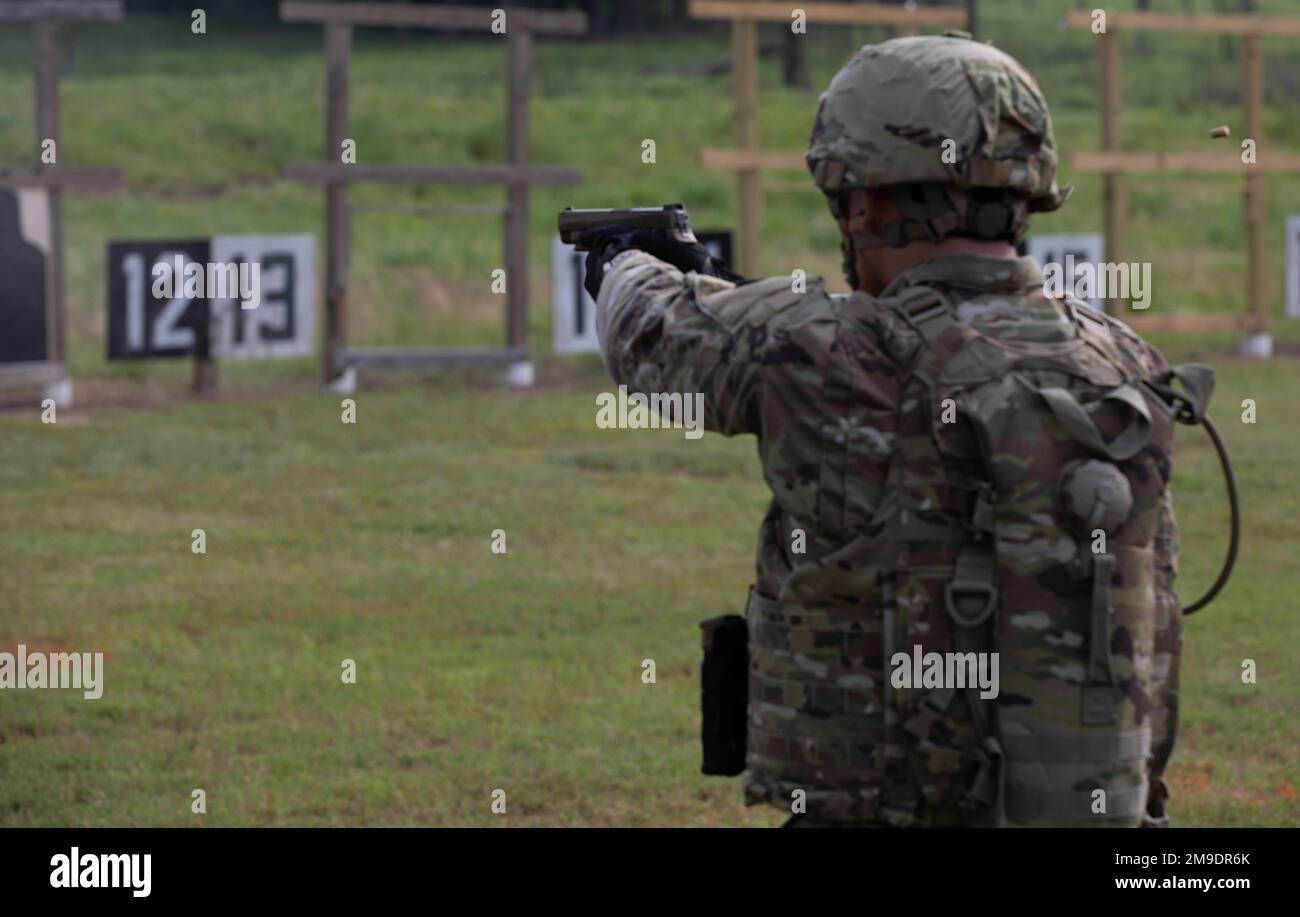 A competitor in the National Guard Training Center aims his weapon ...