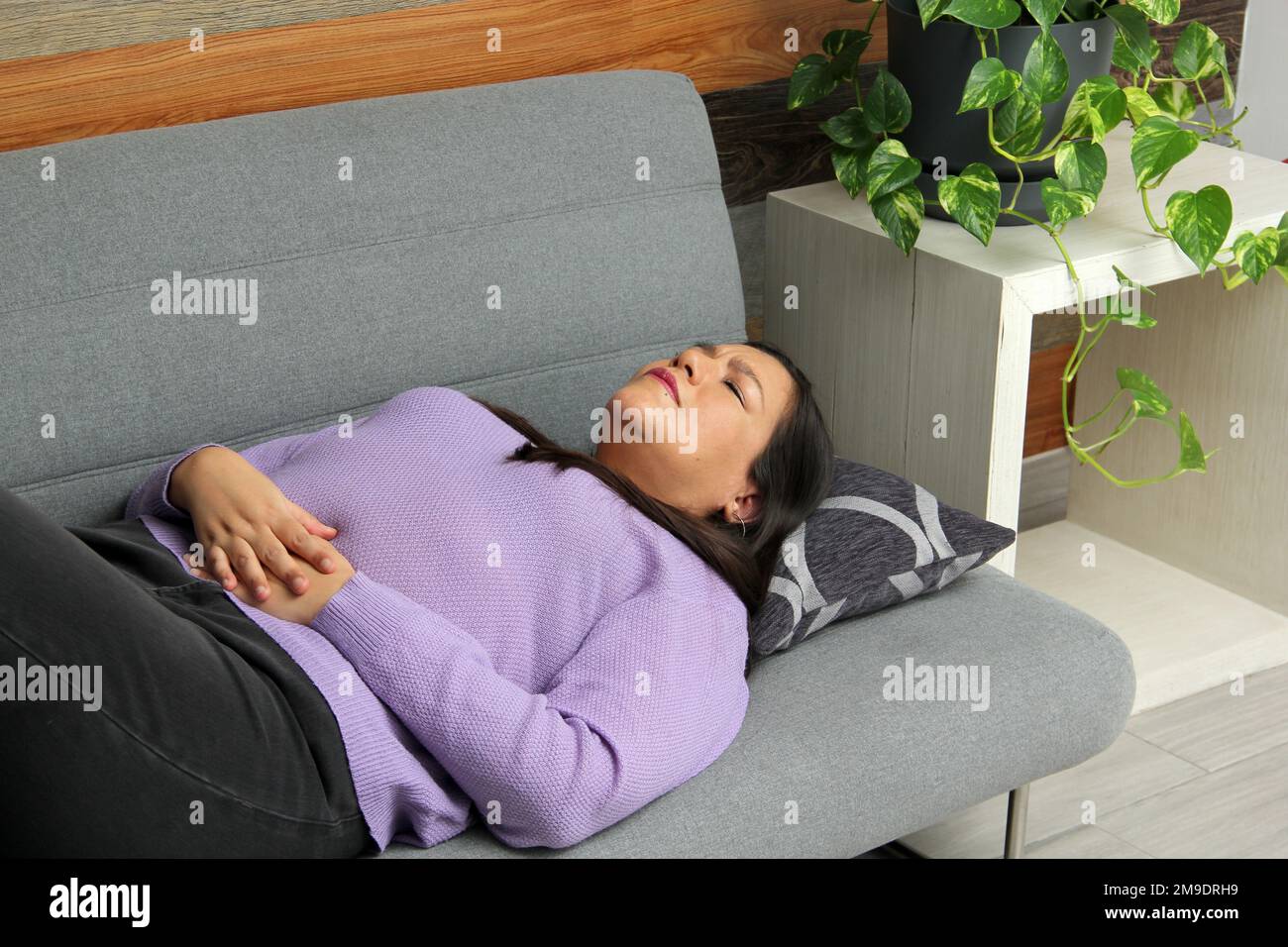 Latin adult woman suffers from a mental disorder of depression and ...
