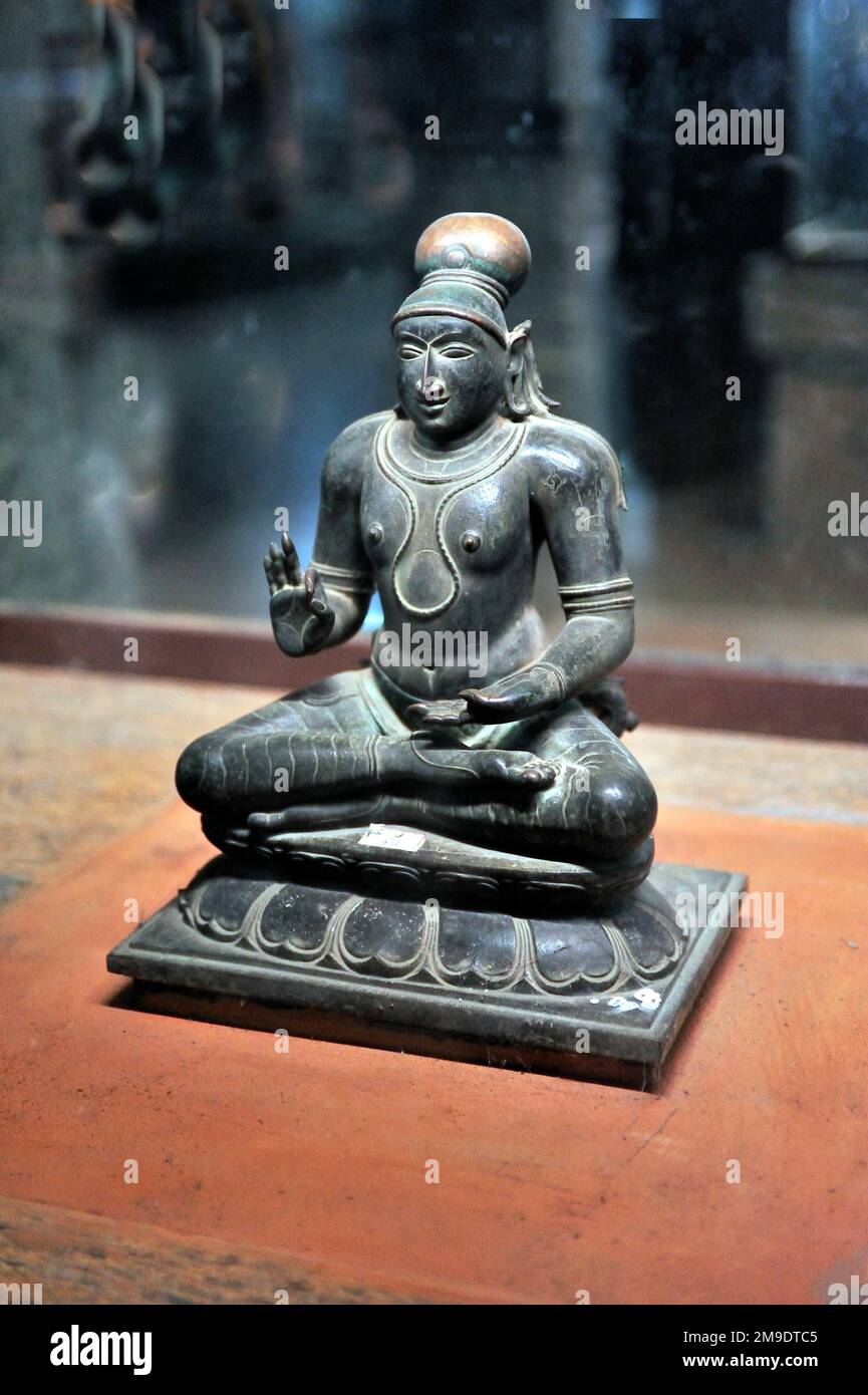 Sculpture of a man in citing pose in bronze Chola dynasty in Meenakshi ...