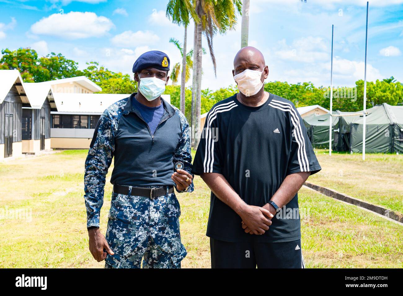 Lieutenant Senior Grade Aldain Facey (left) received a coin from U.S ...
