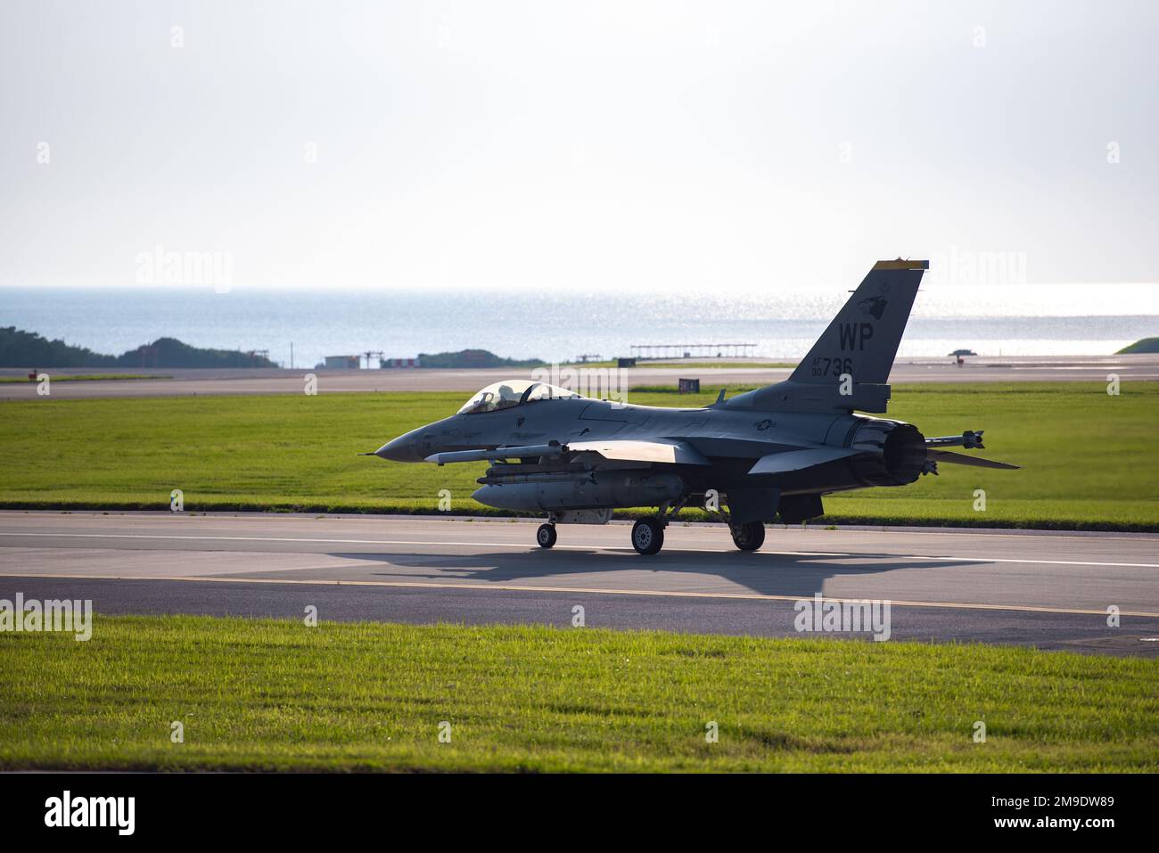 An F-16 Fighting Falcon from the 80th Fighter Squadron taxis down the ...