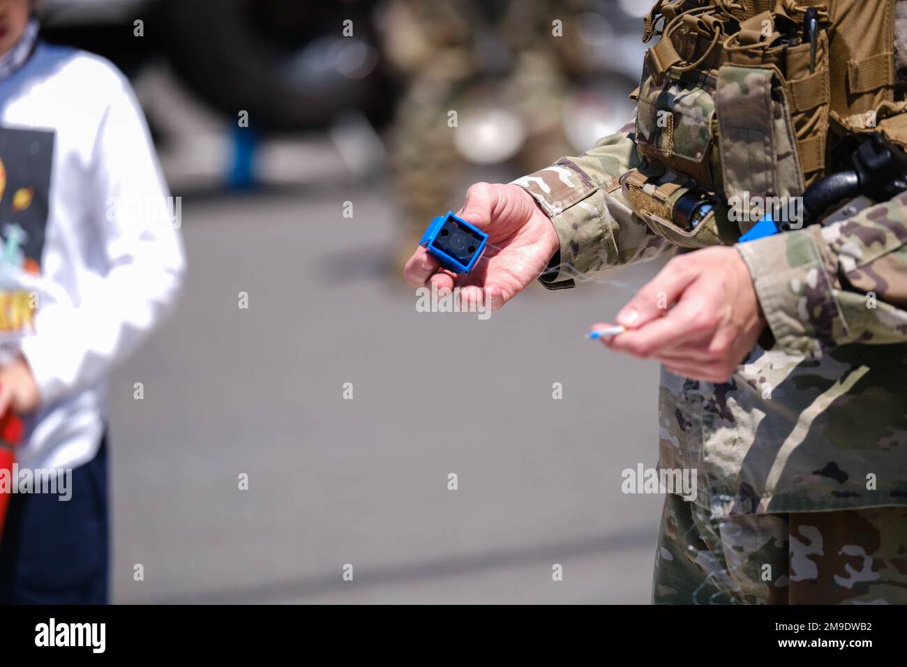 A member of the 35th Security Forces Squadron shows parts of a taser to ...