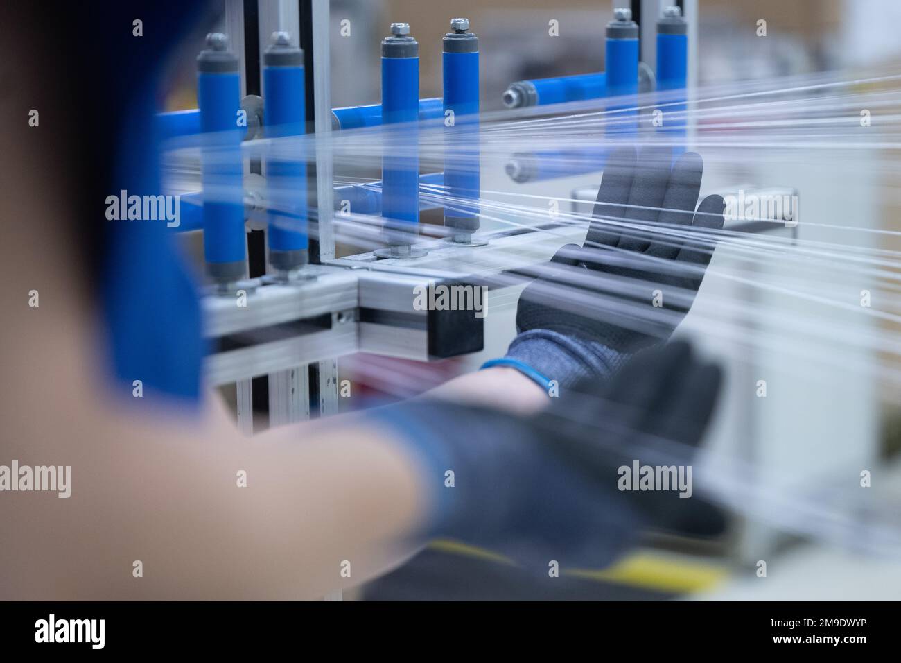 Mainz, Germany. 12th Jan, 2023. A Schott AG employee works in the ...
